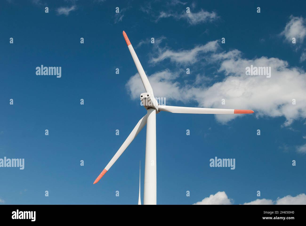 Horizontal wind turbine generator closeup on blue sky background Stock ...