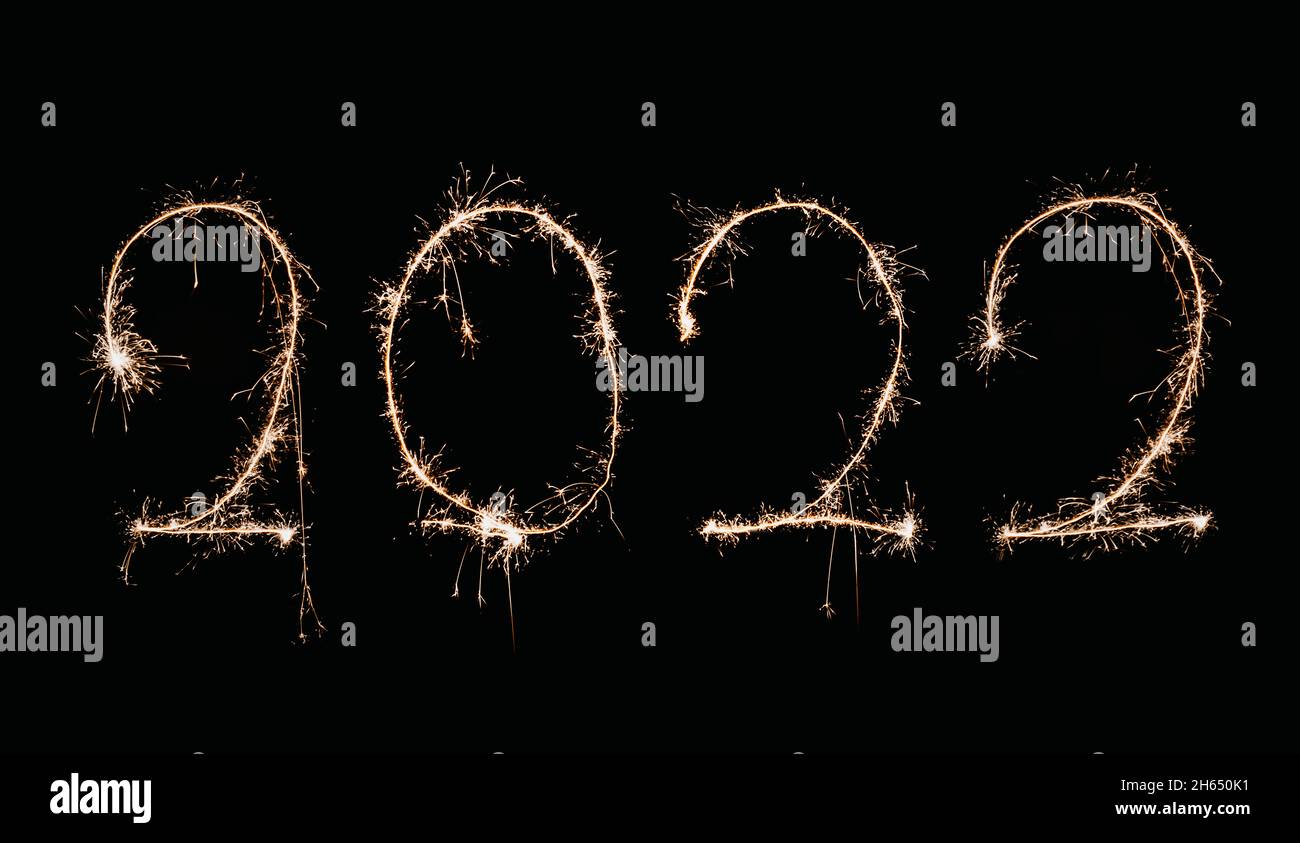 Number 2022 is written with a sparkler. Year Two thousand twenty-two on ...
