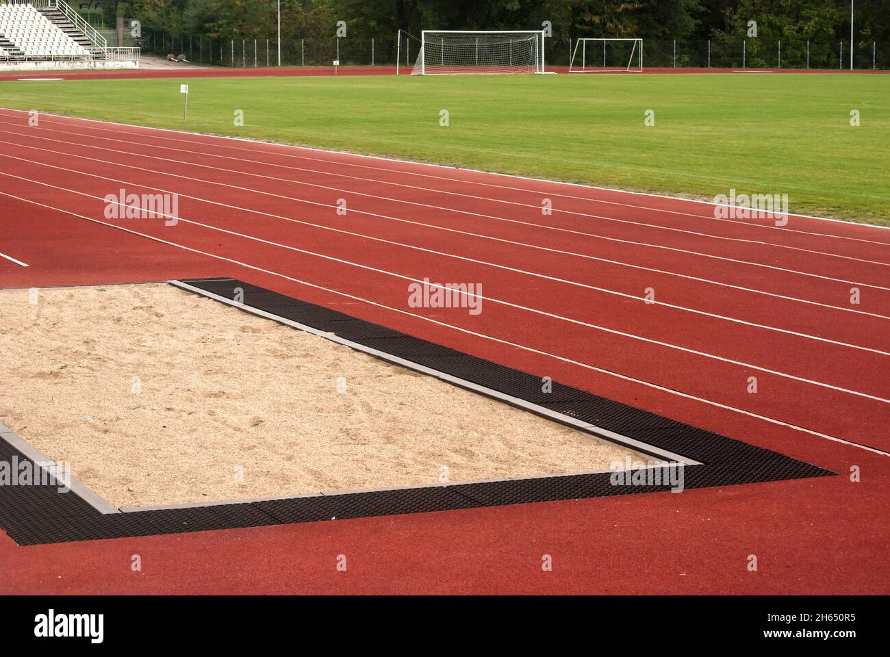 Athletic track red surface and sand trap for long Jump and triple Jump ...