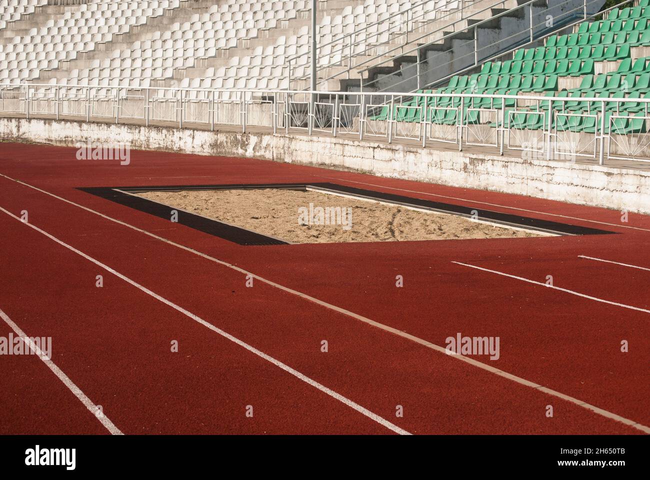 Athletic track red surface and sand trap for long Jump and triple Jump ...
