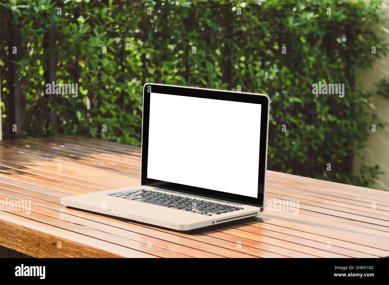 Laptop computer on a wooden table vintage tone Stock Photo - Alamy