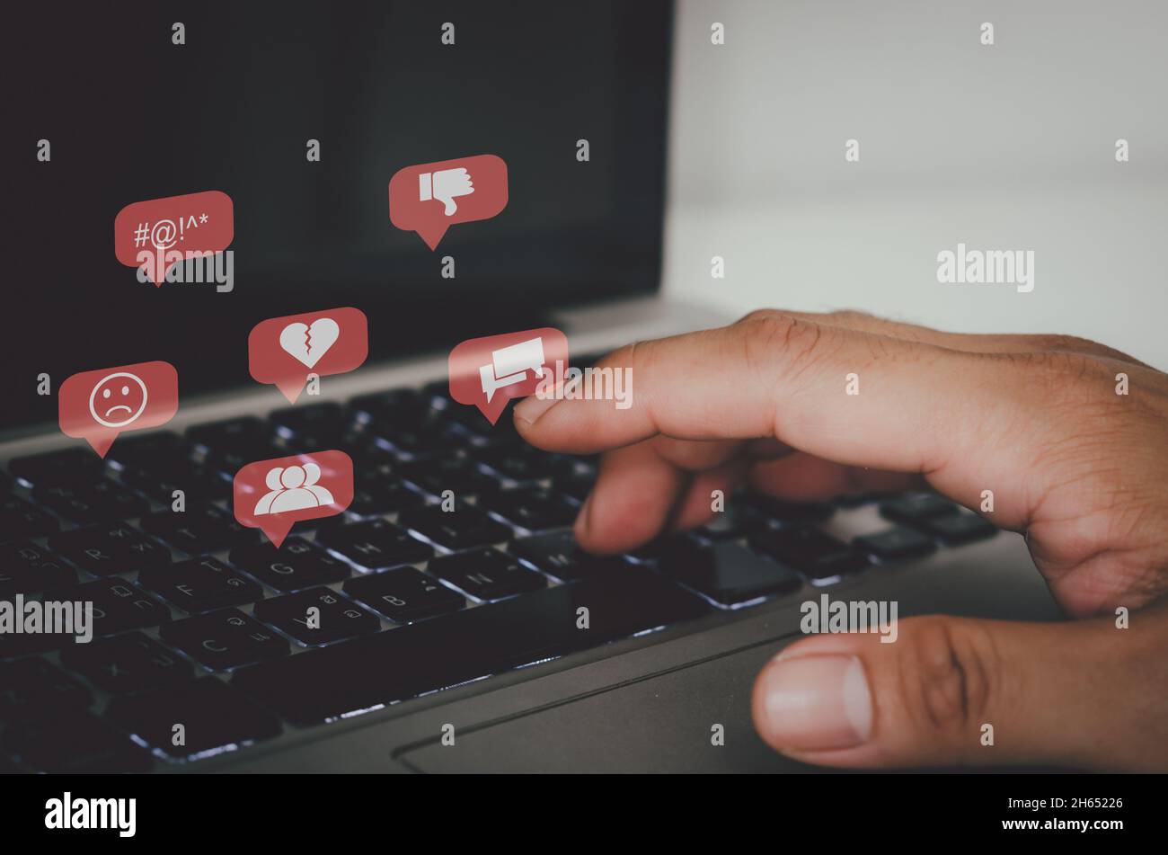 Hand pressing the keyboard of a laptop computer. Icon virtual interface ...