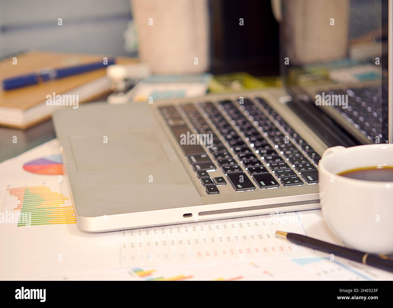 Desk cluttered with business documents.vintage effect style pictures ...