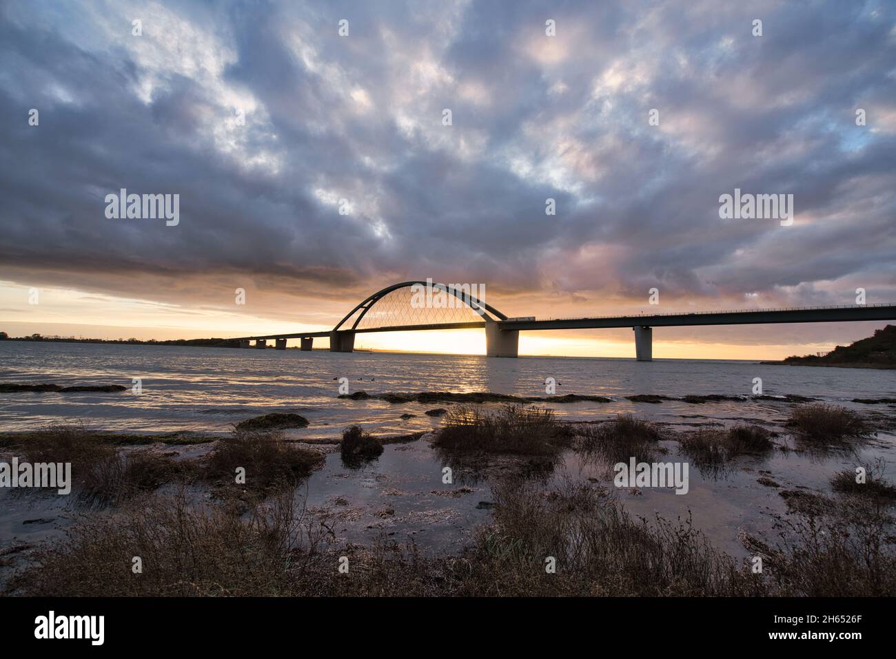 Fehmarn Sound Bridge in Germany at scenic sunset Stock Photo - Alamy