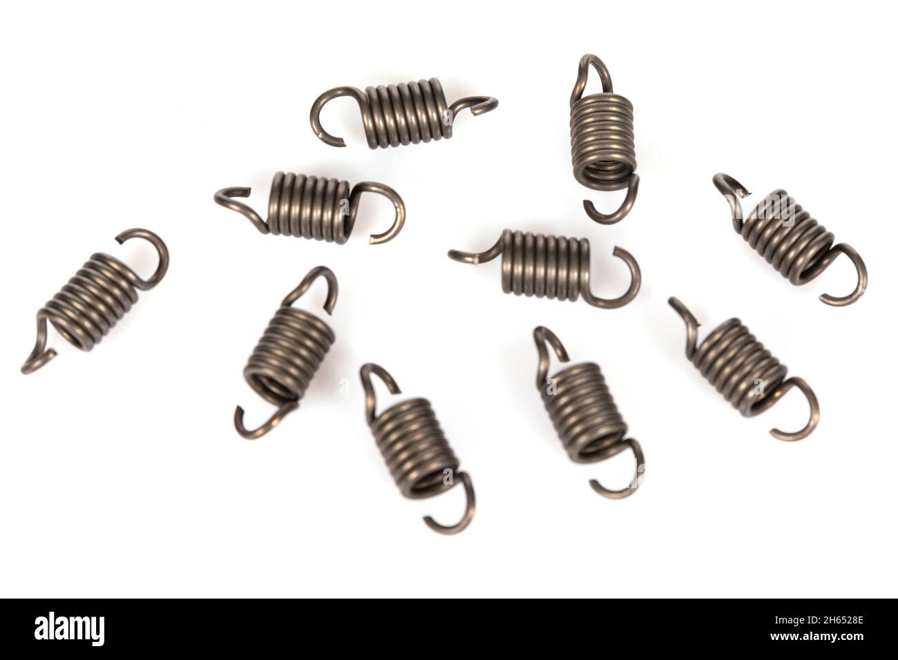 metal springs on a white background, new spare part Stock Photo - Alamy