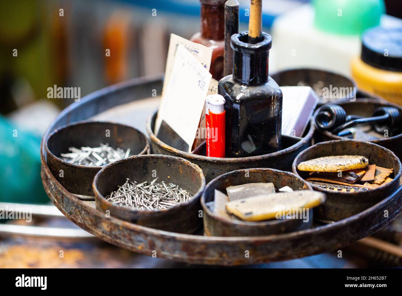 Shoemaker workshop with master shoemaker, old-fashioned workshop ...