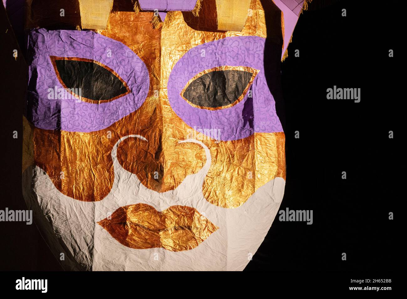 Large human face mask made of gold foil and papier-mâché Stock Photo ...