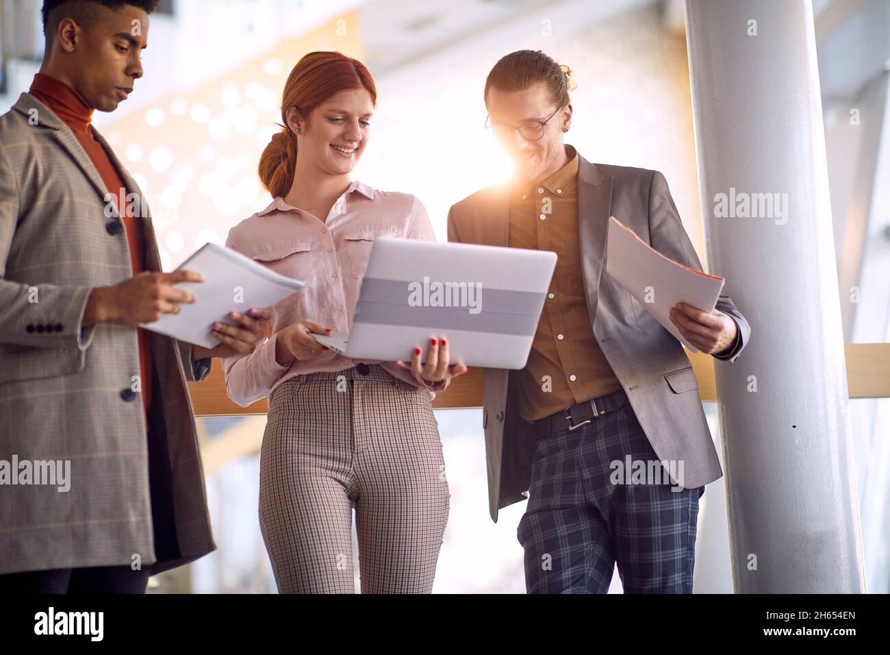 Smiling female employees work hi-res stock photography and images - Alamy