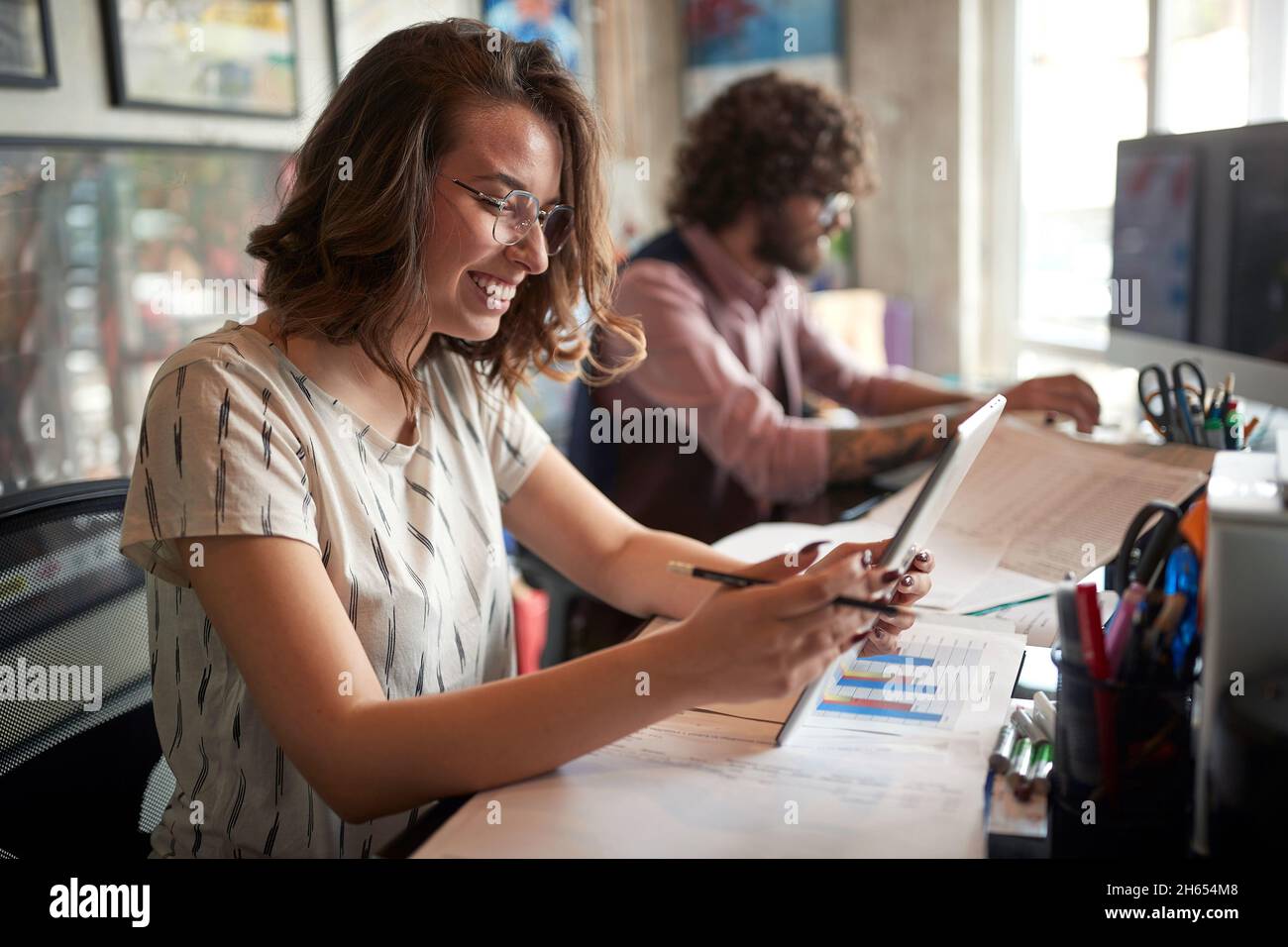 Businessman sitting desk doing paperwork hi-res stock photography and ...