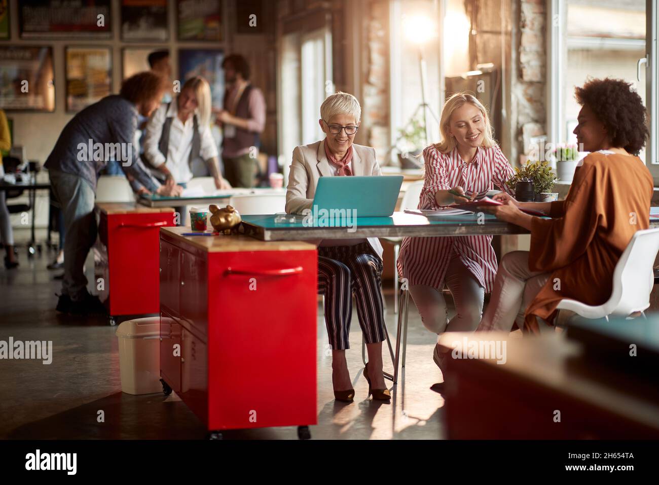 Employees discussing in office typing hi-res stock photography and images - Alamy