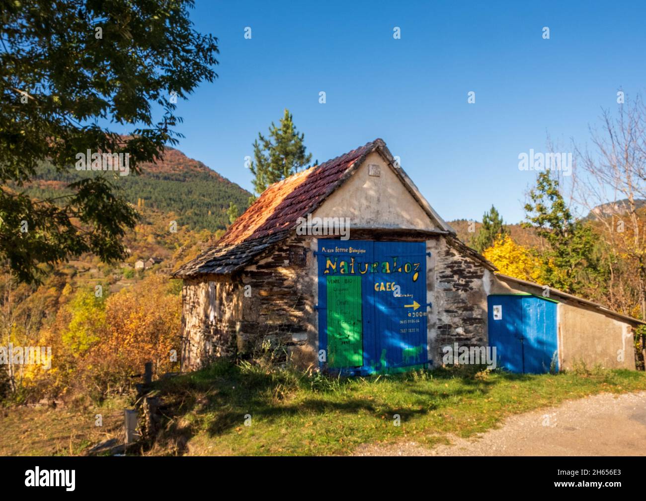 Attractive hand painted barn doors on a stone building in the Tarn ...