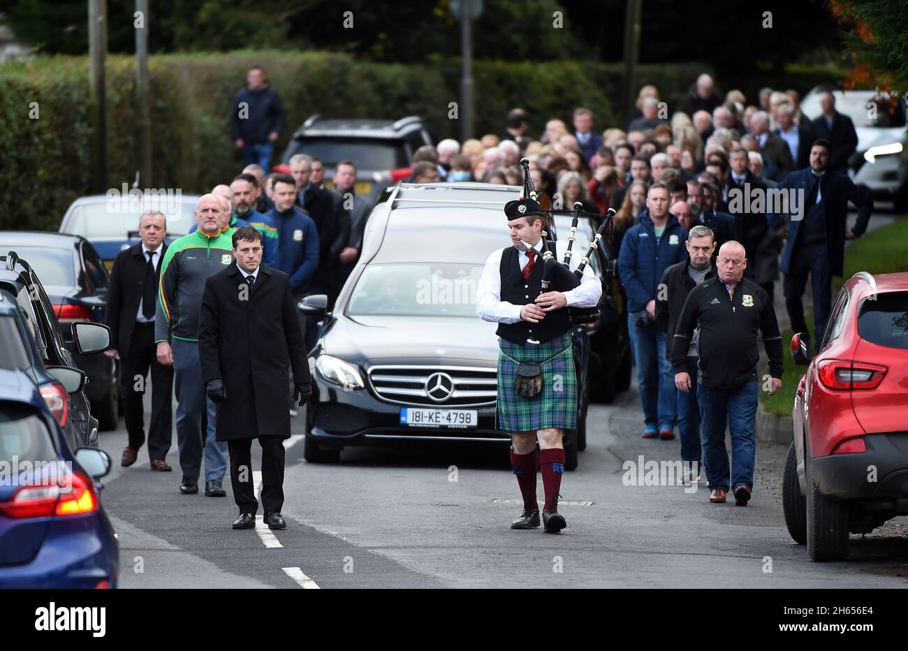A piper leads the funeral cortege of civil rights leader Austin Currie ...