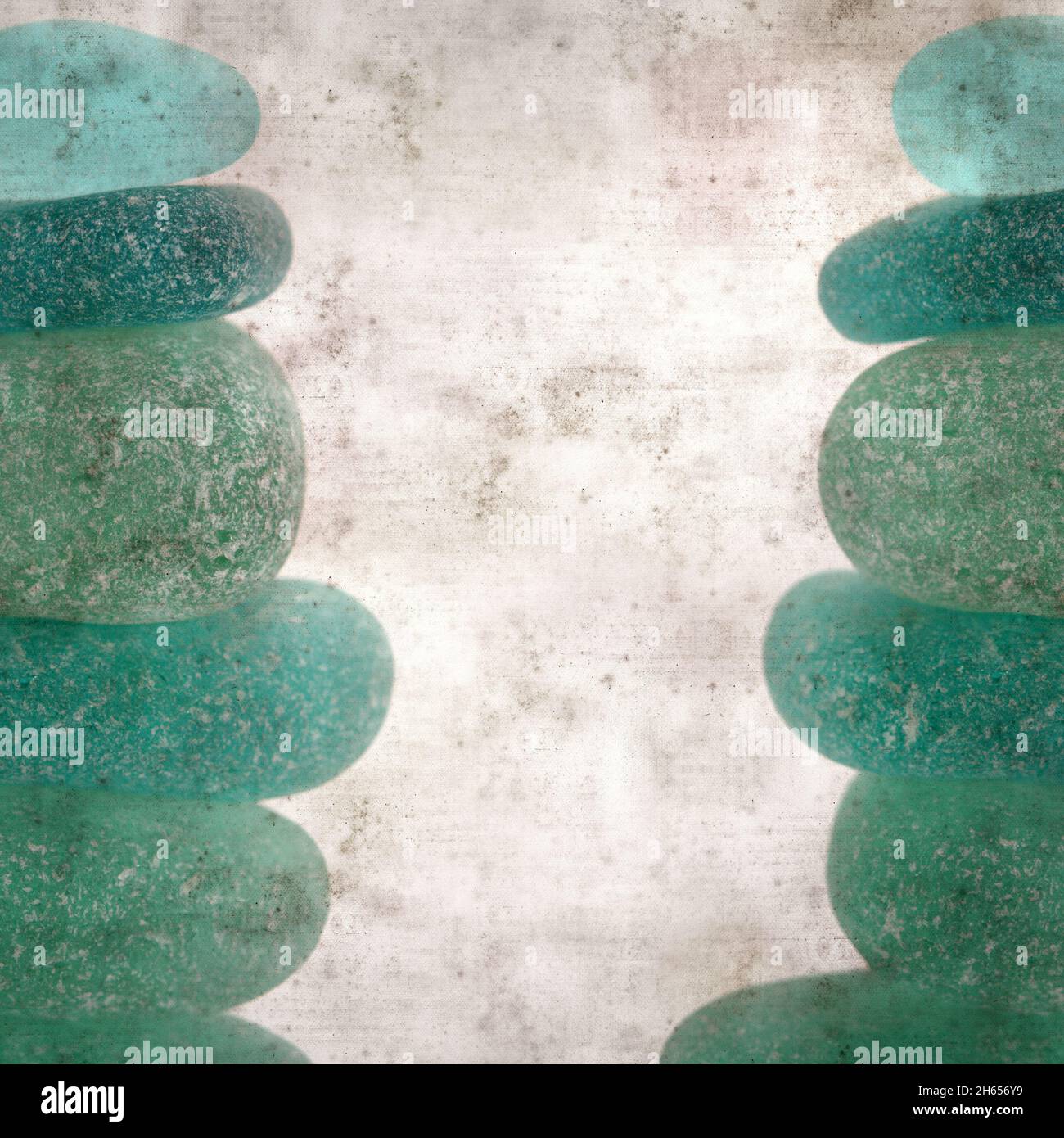 stylish textured old paper background with sea glass pebble pieces ...