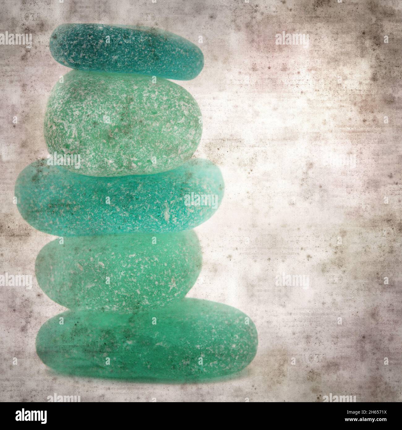 stylish textured old paper background with sea glass pebble pieces ...