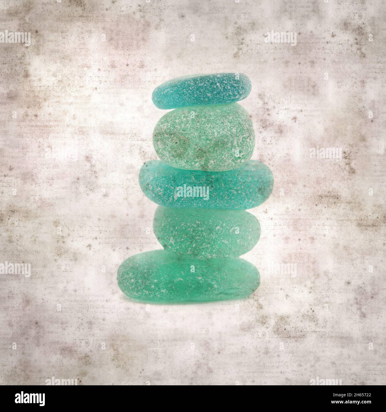 stylish textured old paper background with sea glass pebble pieces ...