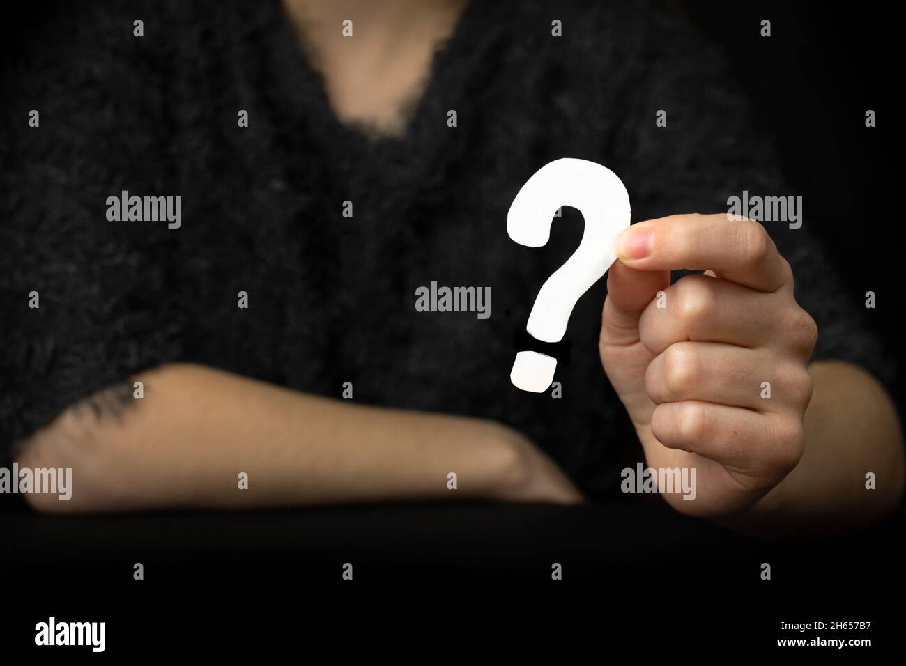 Woman hand with question mark sign. Question icon, symbol on a black ...