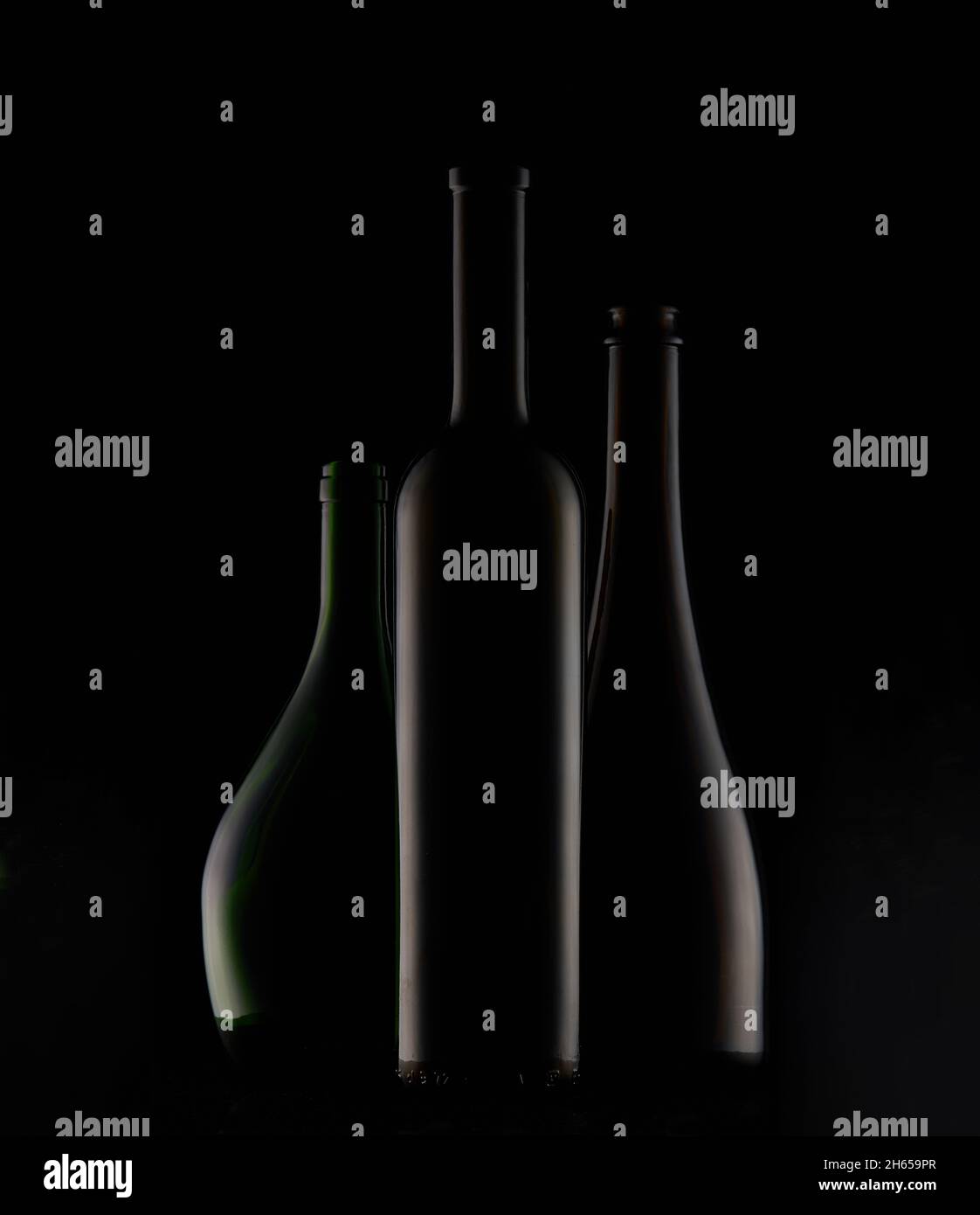 Vertical shot of different alcohol bottles on a dark background Stock ...