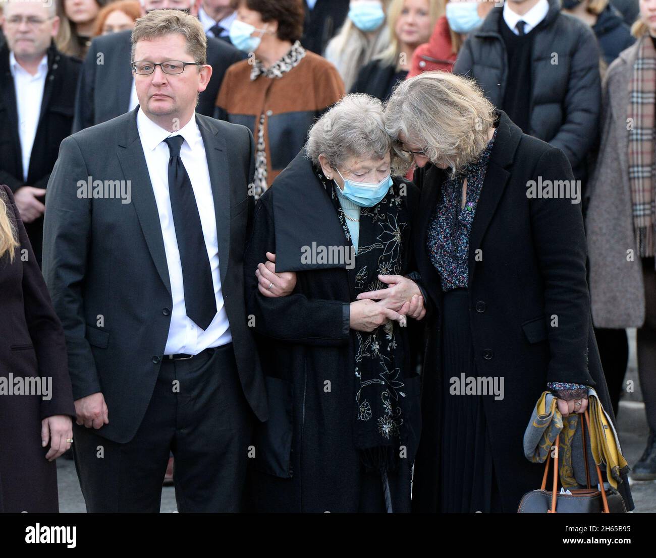 Son Austin Og, widow Anita and daughter Estelle at the funeral service ...