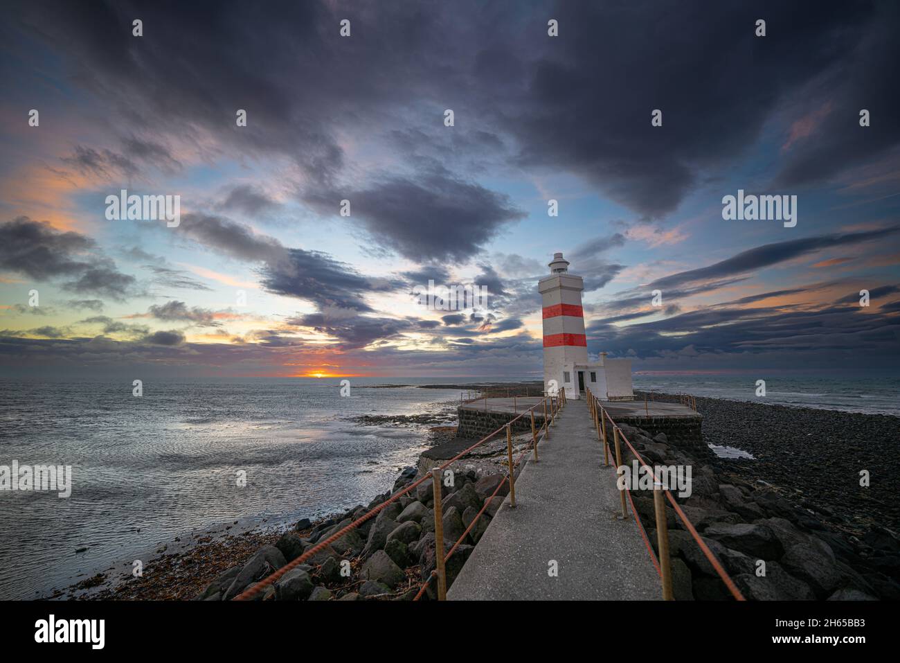 The old Gardur lighthouse at sunset, Iceland Stock Photo - Alamy