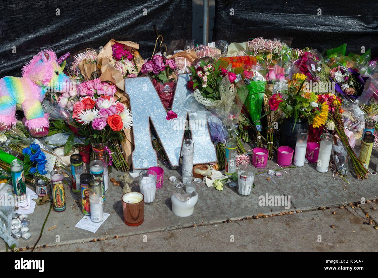 A growing tribute to Madison Dubiski, 23, at the memorial for the ...