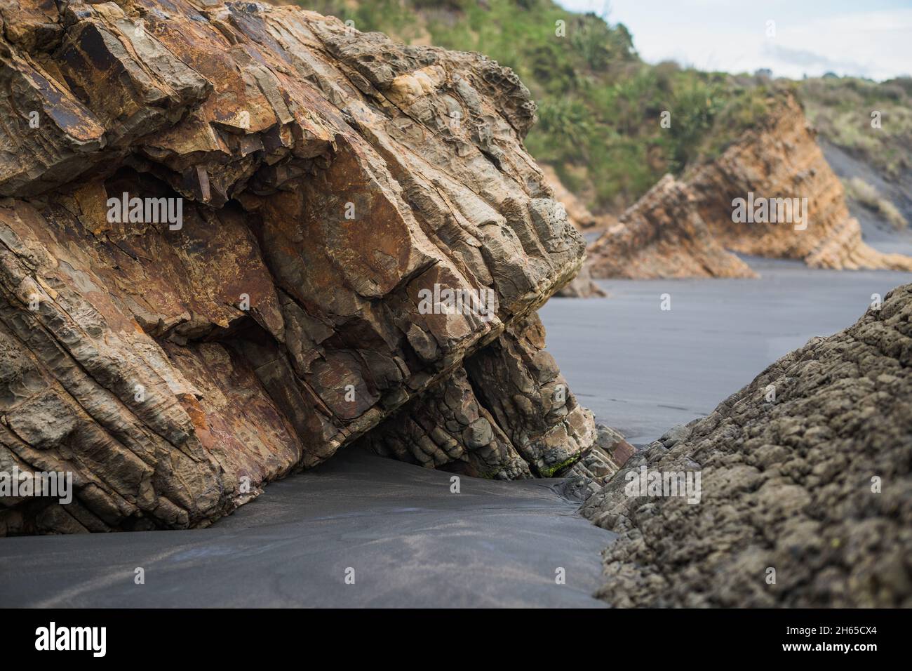 Magnetic black sand on the beach, New Zealand Stock Photo - Alamy