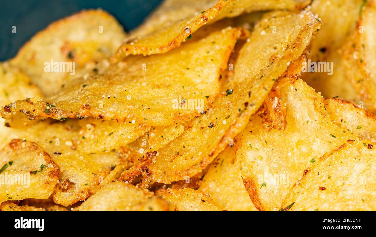Natural fat potato chips with salt, black pepper, herbs and vegetable ...