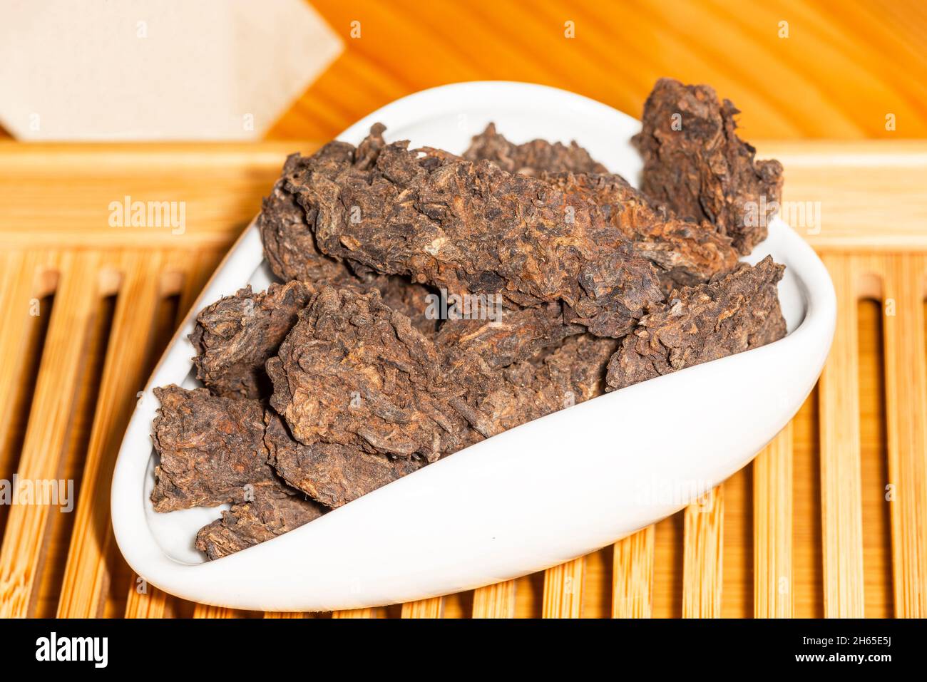 Chinese aged Puer Lao Cha Tou or Old Heads tea in a tea presentation ...