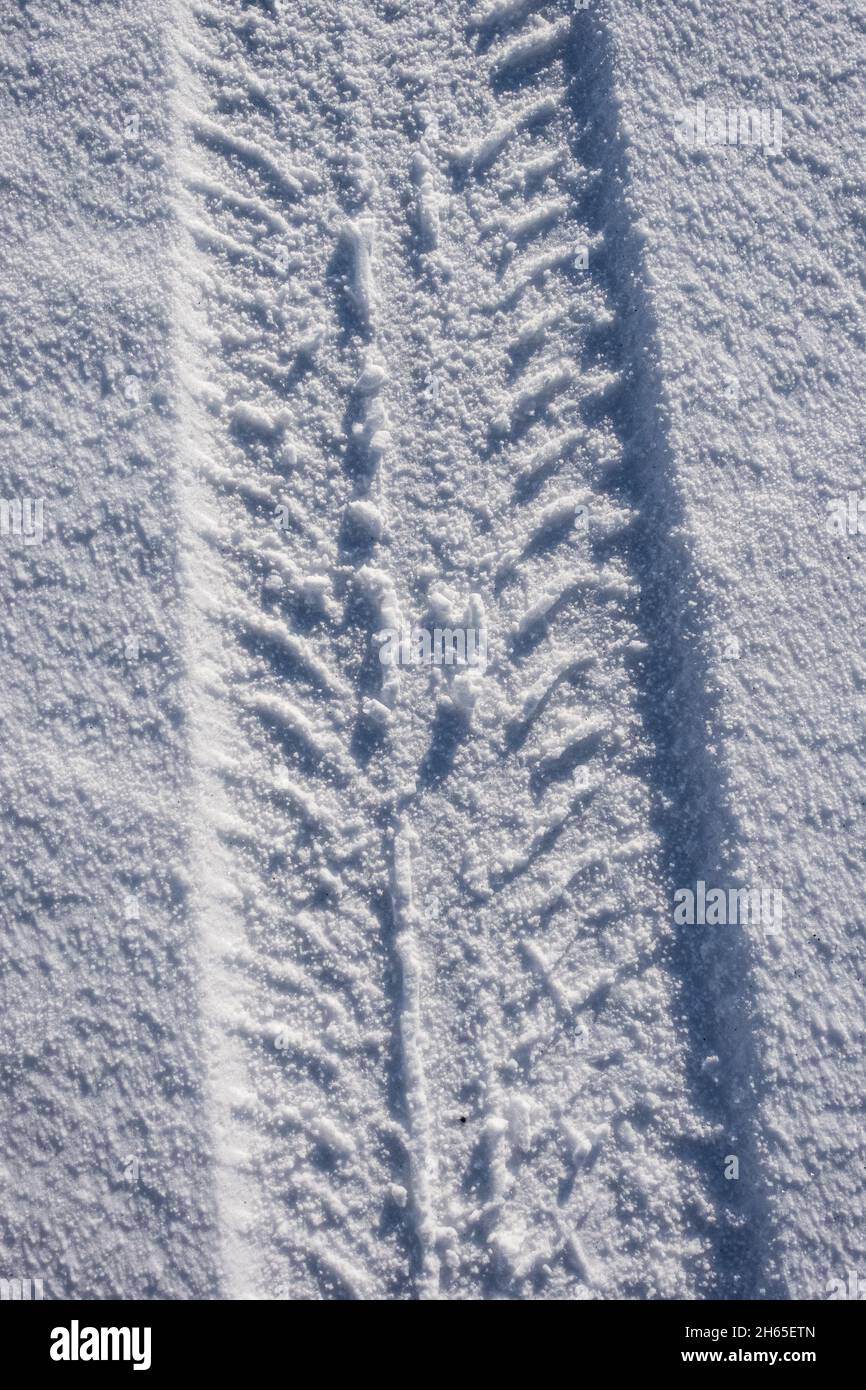 Snow road track marks in Iceland Stock Photo - Alamy