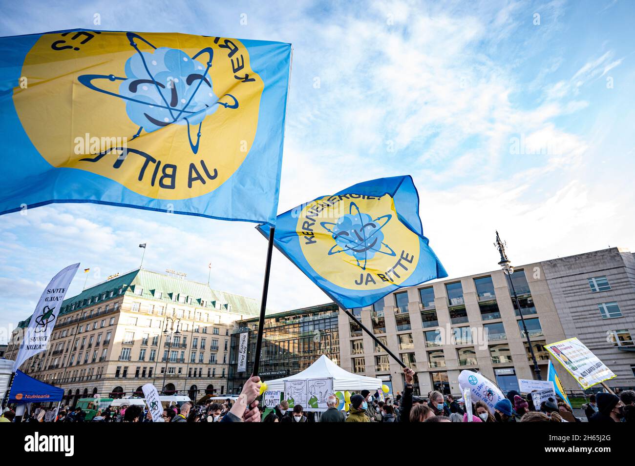 Berlin, Germany. 13th Nov, 2021. Participants hold up flags with the ...