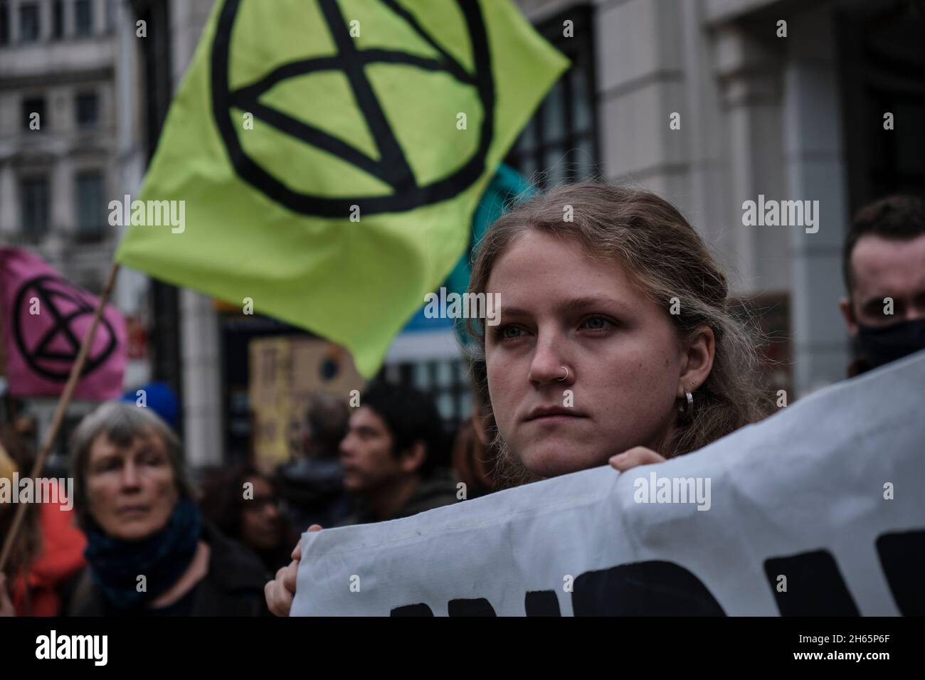 London, UK. 13th Nov, 2021. A young Extinction Rebellion's activist at ...