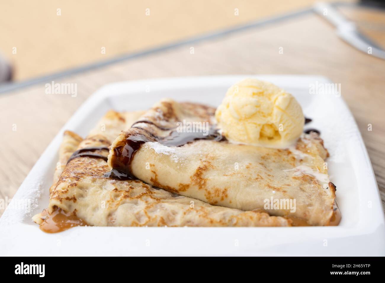 Delicious caramelized condensed milk crepes plate with vanilla ice ...