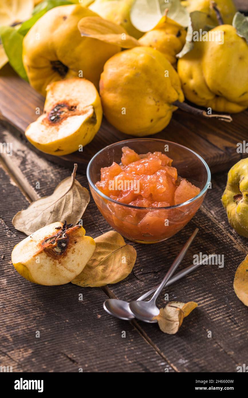 Ripe whole quince and sweet jam from it. Fresh fruit, an essential ...