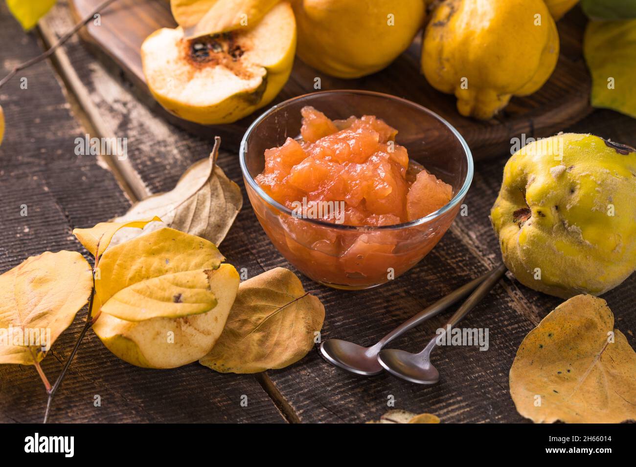 Ripe whole quince and sweet jam from it. Fresh fruit, an essential ...