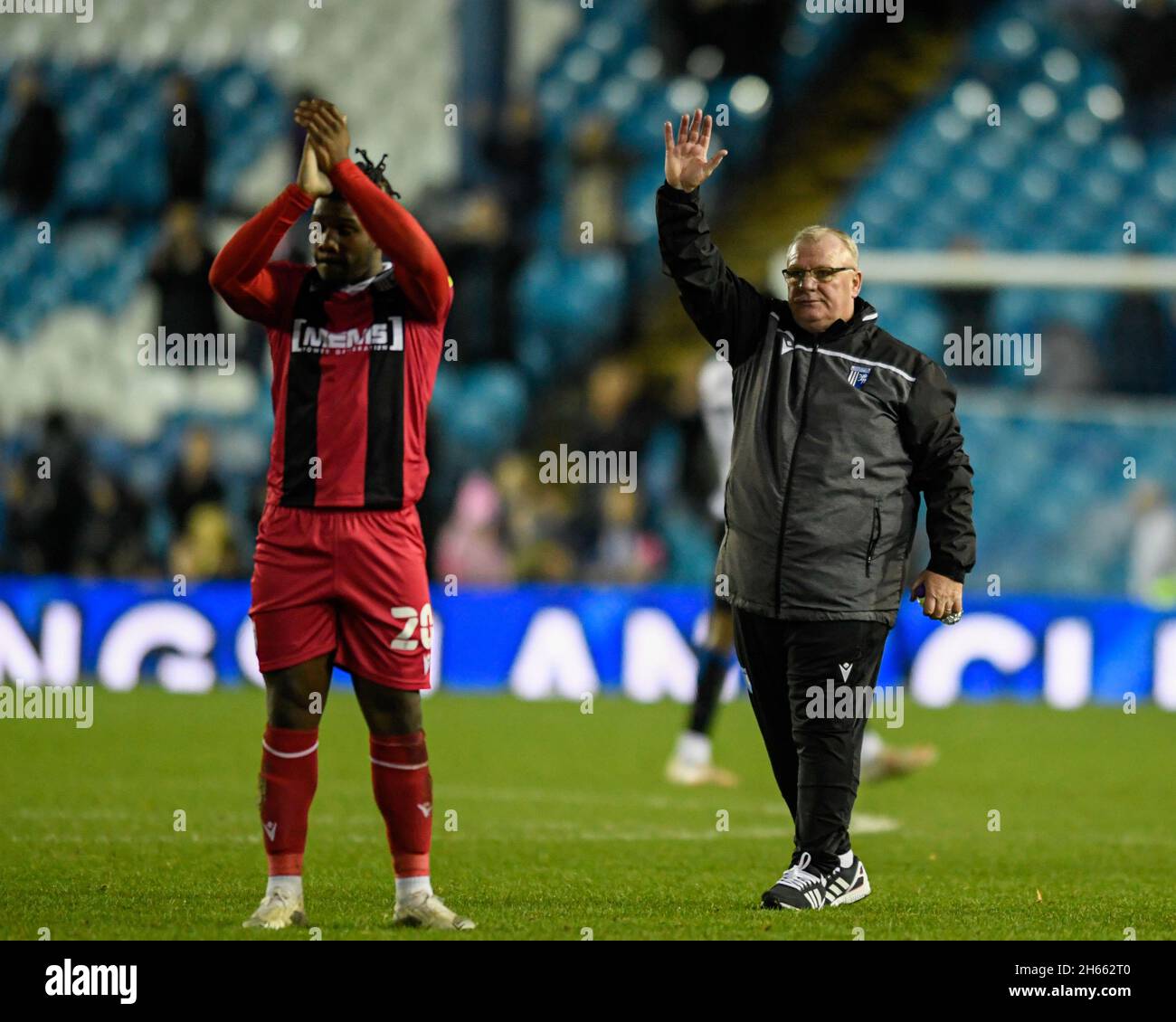 Steve Evans manager of Gillingham waves to the travelling supporters ...