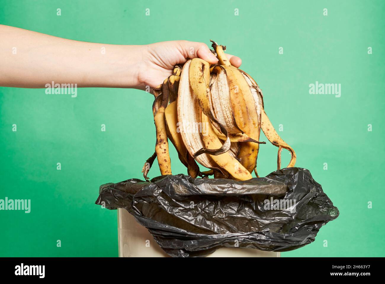 Woman Throwing Banana Peels In Trash Can Throw Out Banana Peels In
