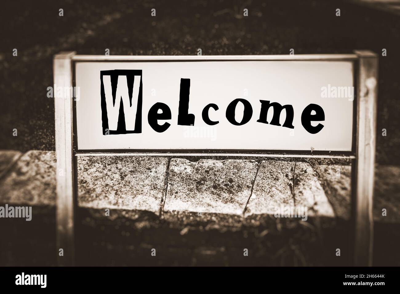 Welcome displayed on a street sign Stock Photo - Alamy