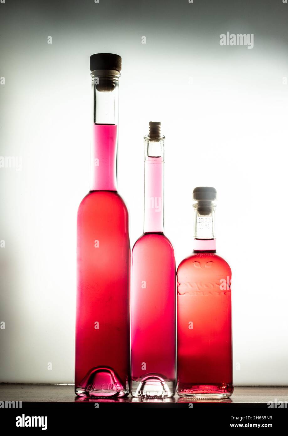 fruit liquid in transparent bottles Stock Photo - Alamy