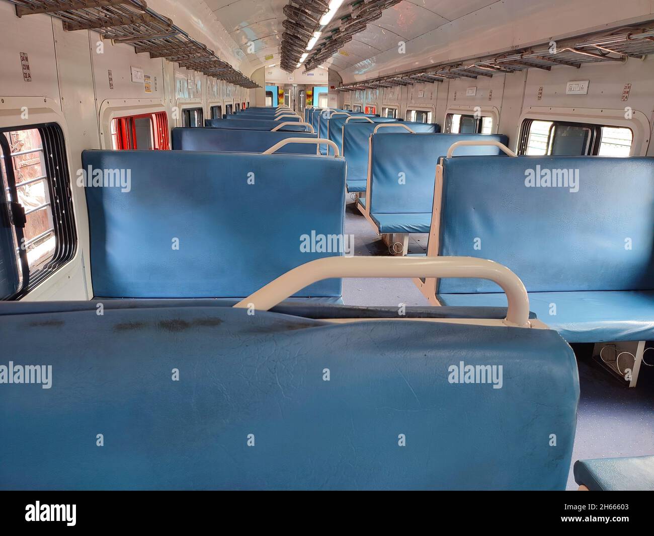 Interior of an old bus with blue seats Stock Photo - Alamy