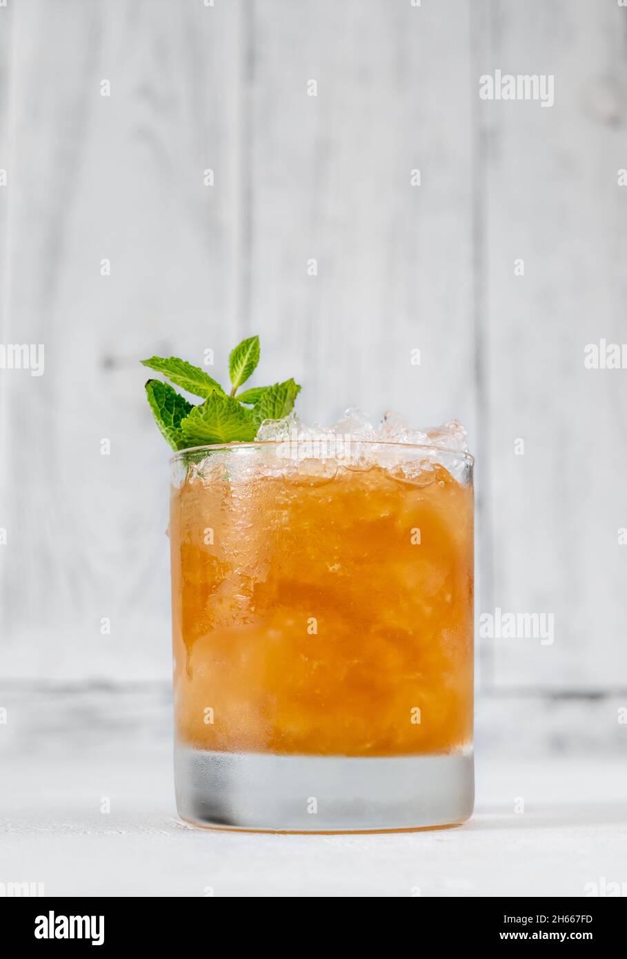 Glass of Ancient Mariner Cocktail garnished with fresh mint Stock Photo ...