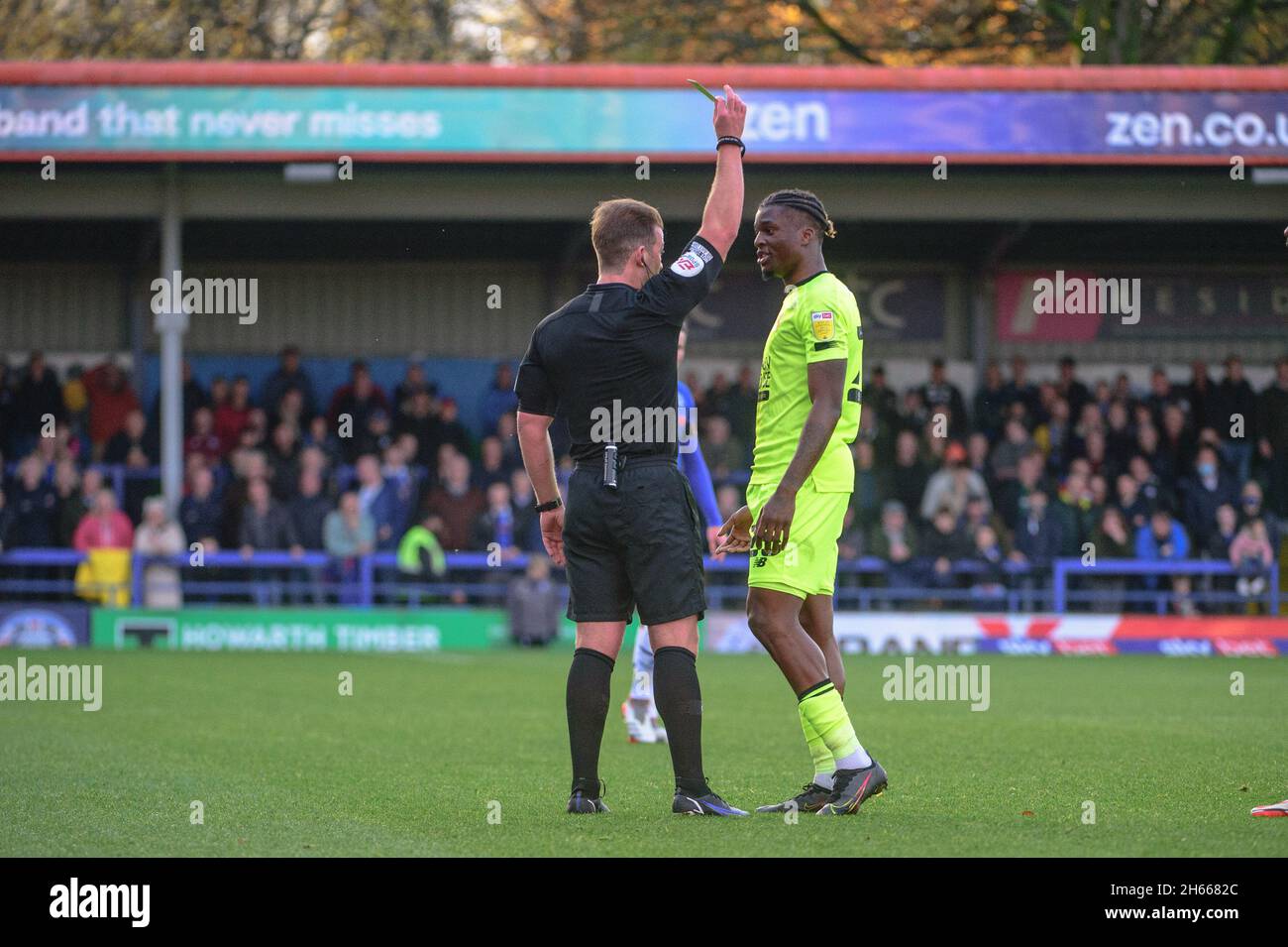 ROCHDALE, GBR. NOV 13TH Referee Anthony Backhouse shows Shadrach Ogie ...