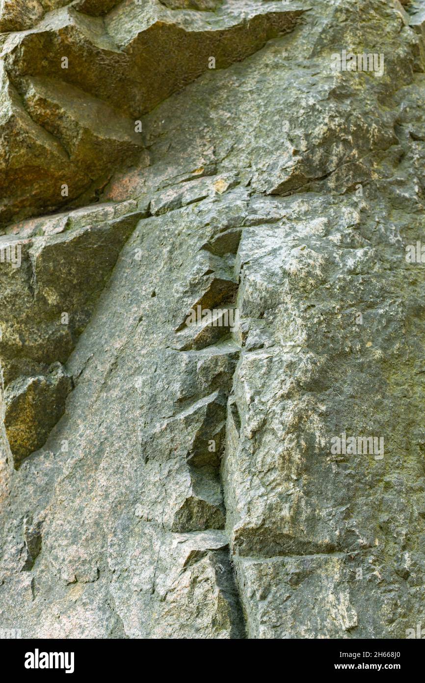 Cracks in the granite rock due to human activity. Destruction of the ...