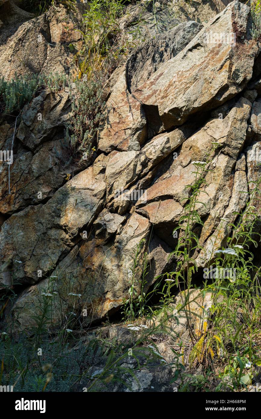 Cracks in the granite rock due to human activity. Destruction of the ...
