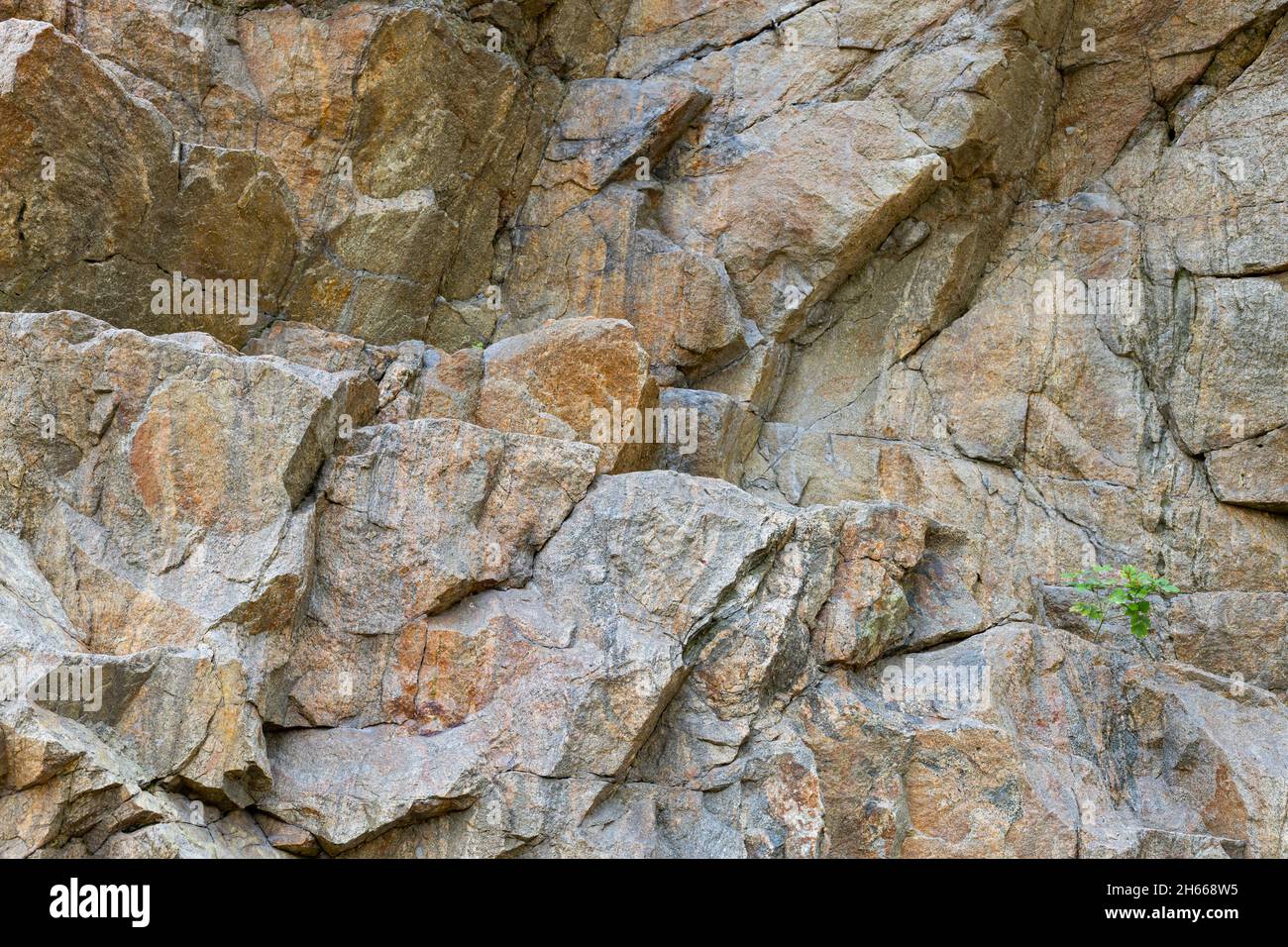Cracks in the granite rock due to human activity. Destruction of the ...