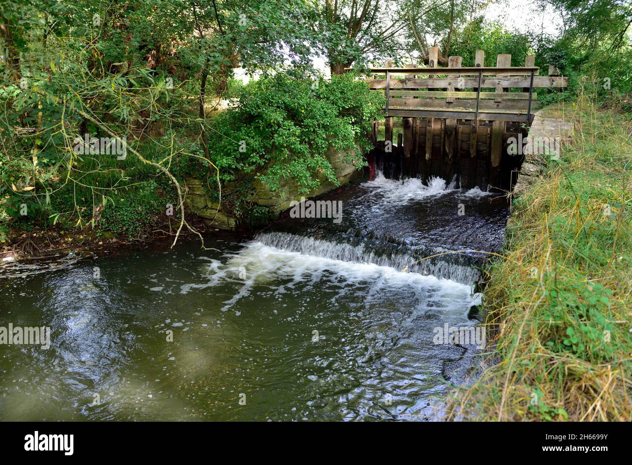 Old mill leat and small wear on the River Alne in Warwickshire, UK ...