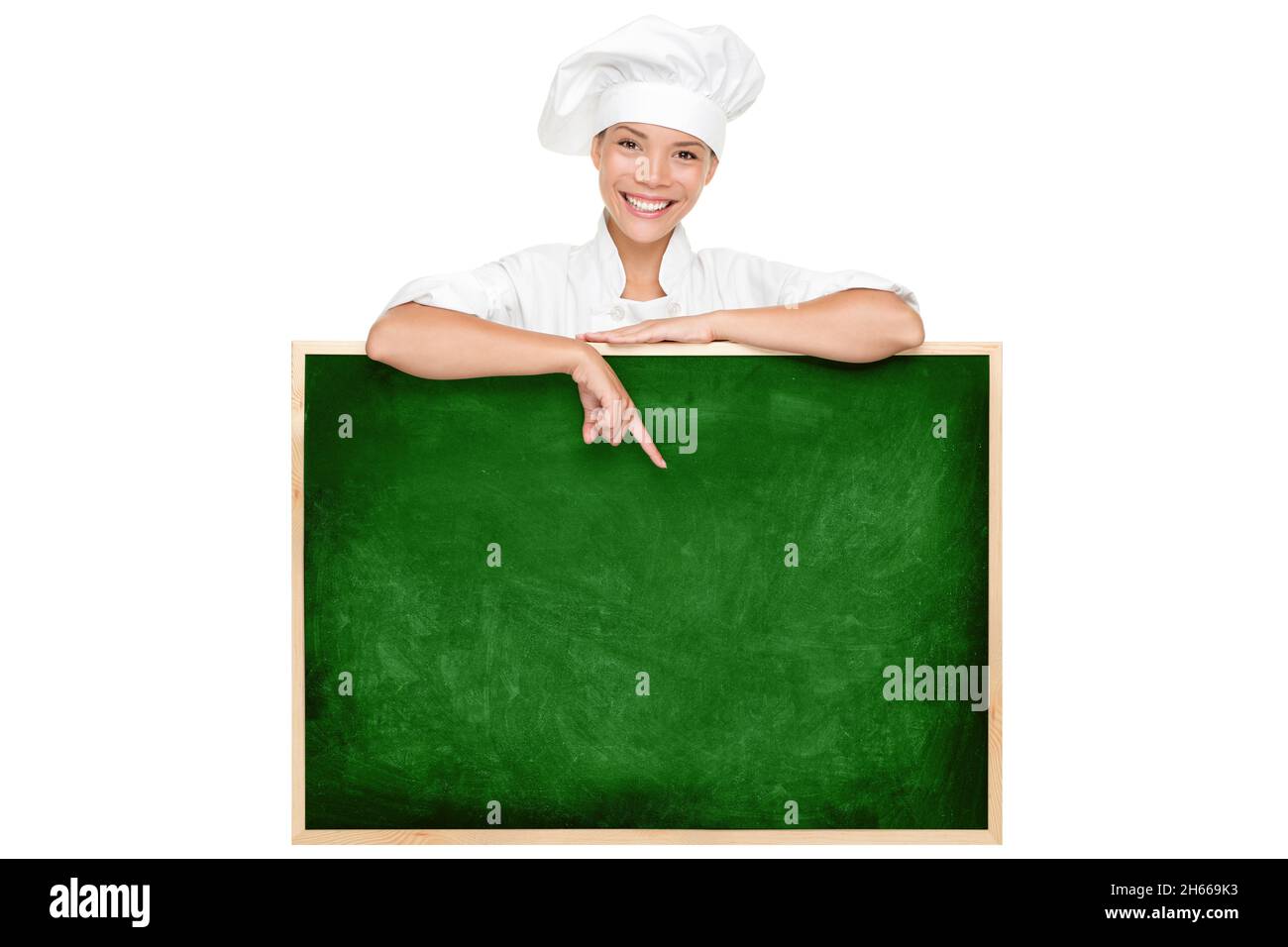 Chef showing menu green board sign blackboard smiling happy. Empty menu ...