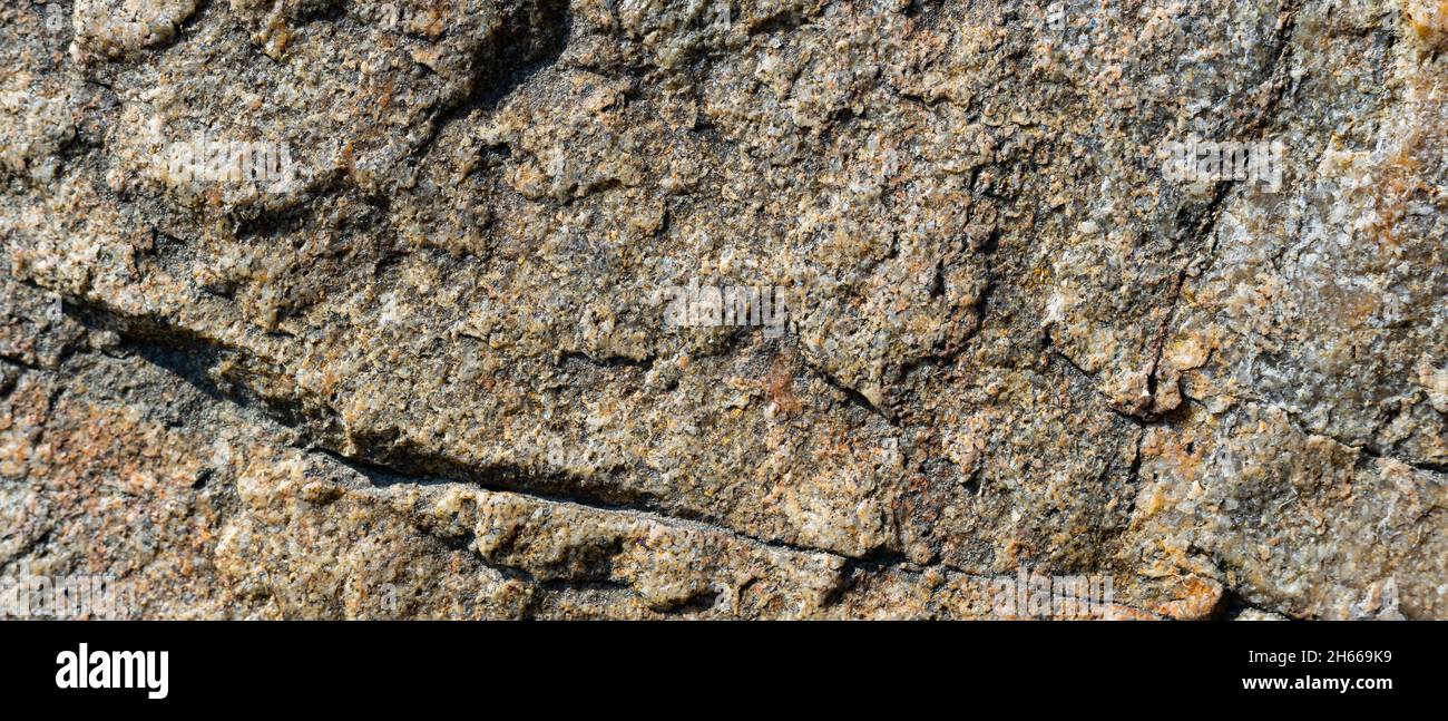 Granite rock texture. Cracked granite surface from weathering. Close-up ...