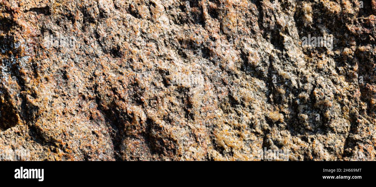 Granite rock texture. Cracked granite surface from weathering. Close-up ...