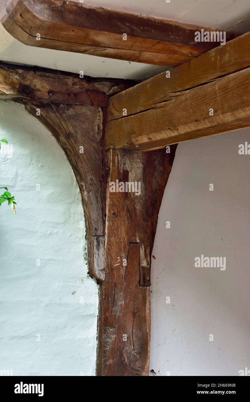 Old traditional arched brace joint on jettied upper wall and mortice ...