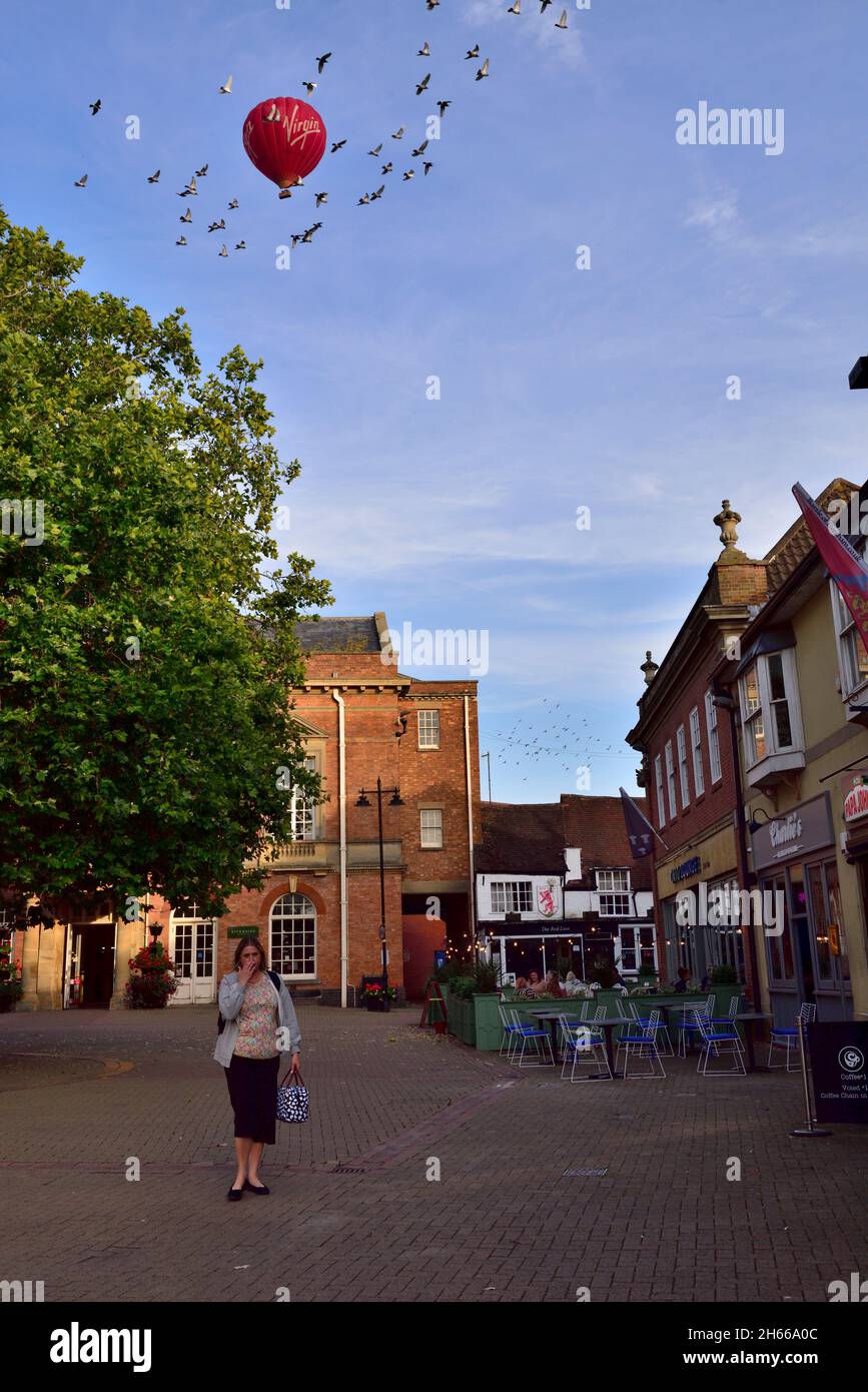 Market square in market town of Evesham, hot air balloon with seagulls ...