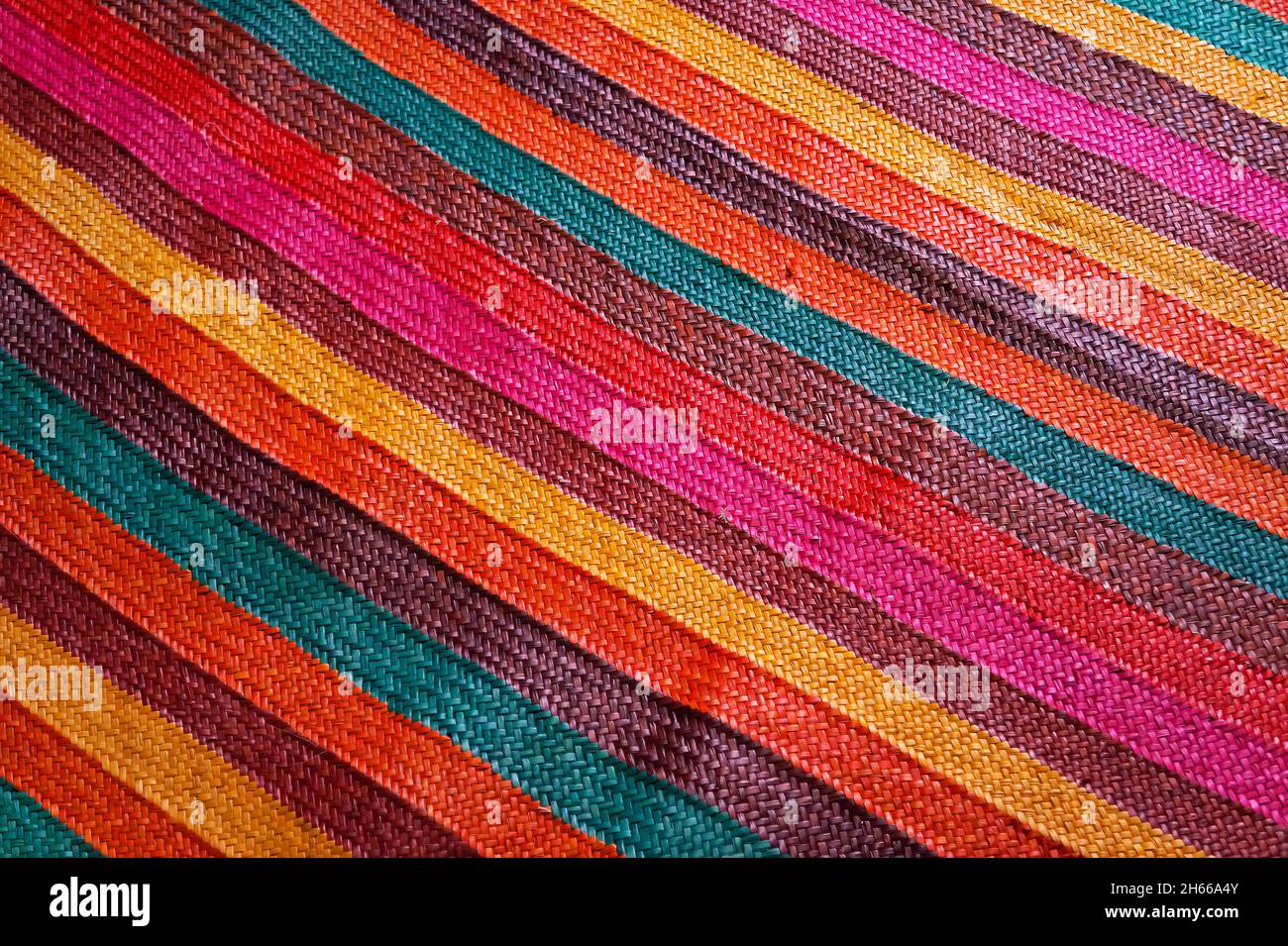 Handicraft with colorful striped straw Stock Photo - Alamy
